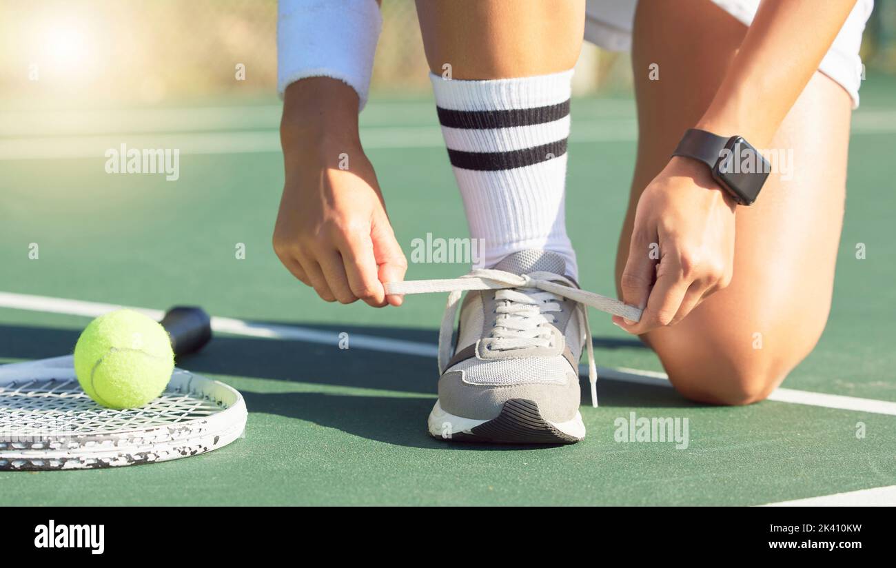 Tennis, sports and woman tie shoes ready for match, game or training ...