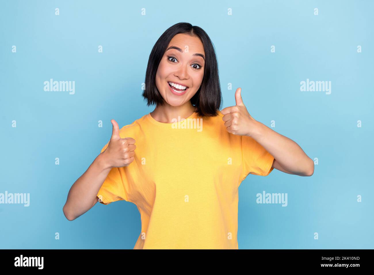 Photo portrait of nice young lady korean show double thumb up excited ...