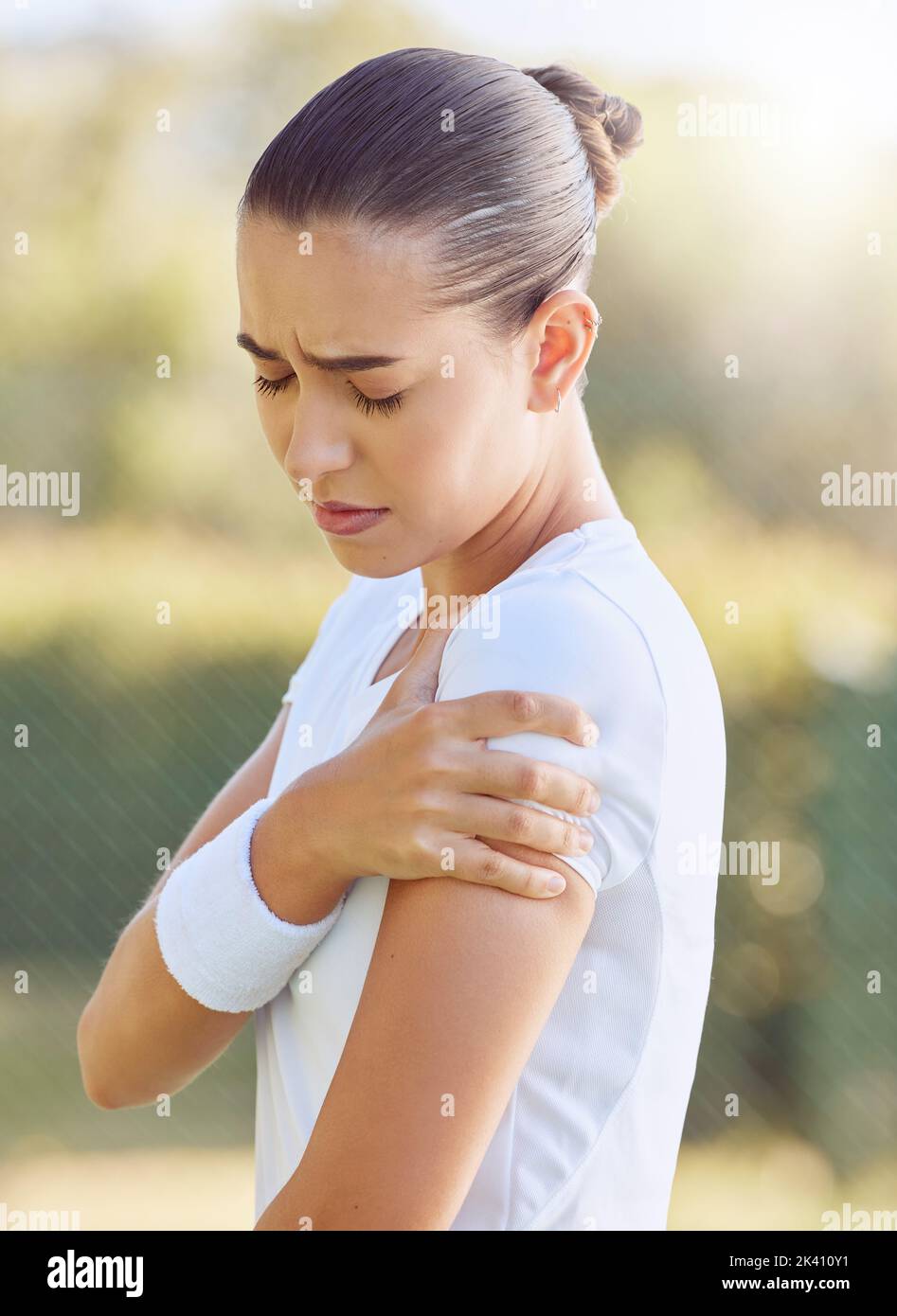Sport, exercise and pain with an arm injury on a sports woman standing ...