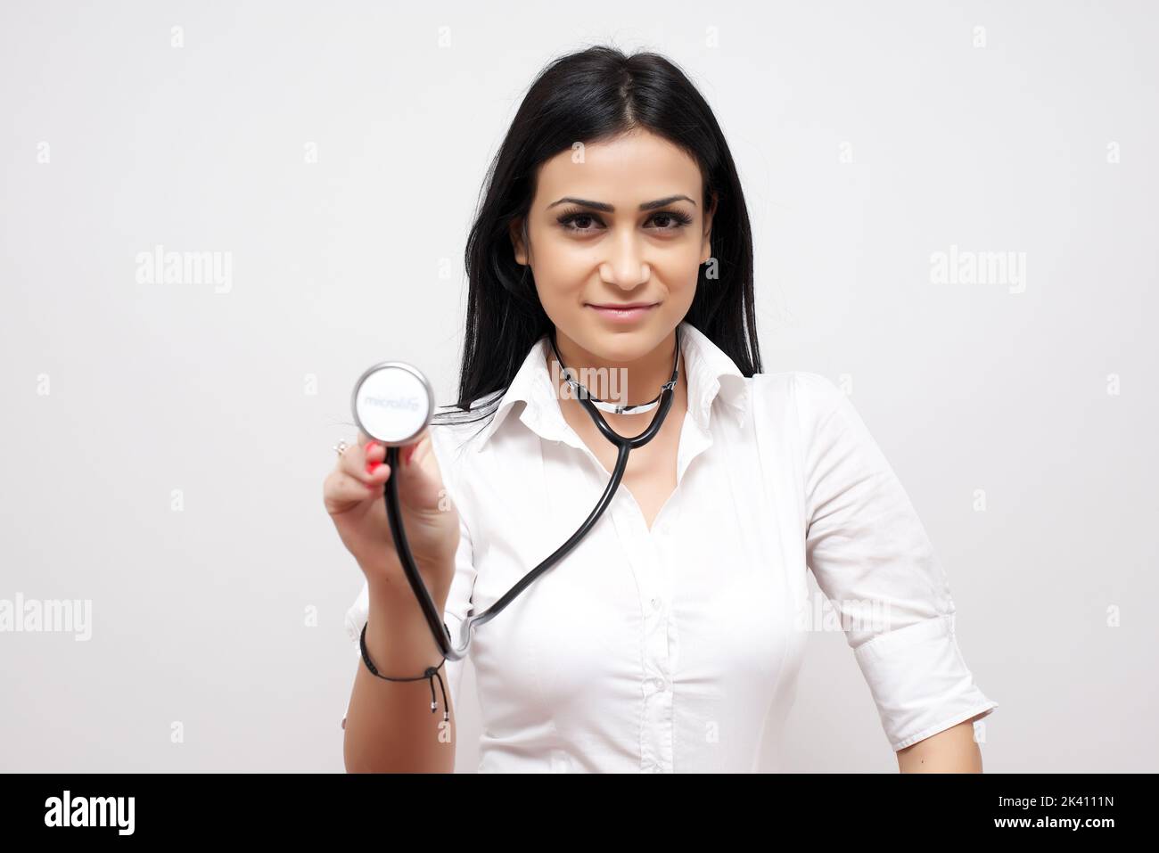 Portrait of beautiful female doctor doing different things - Stock ...