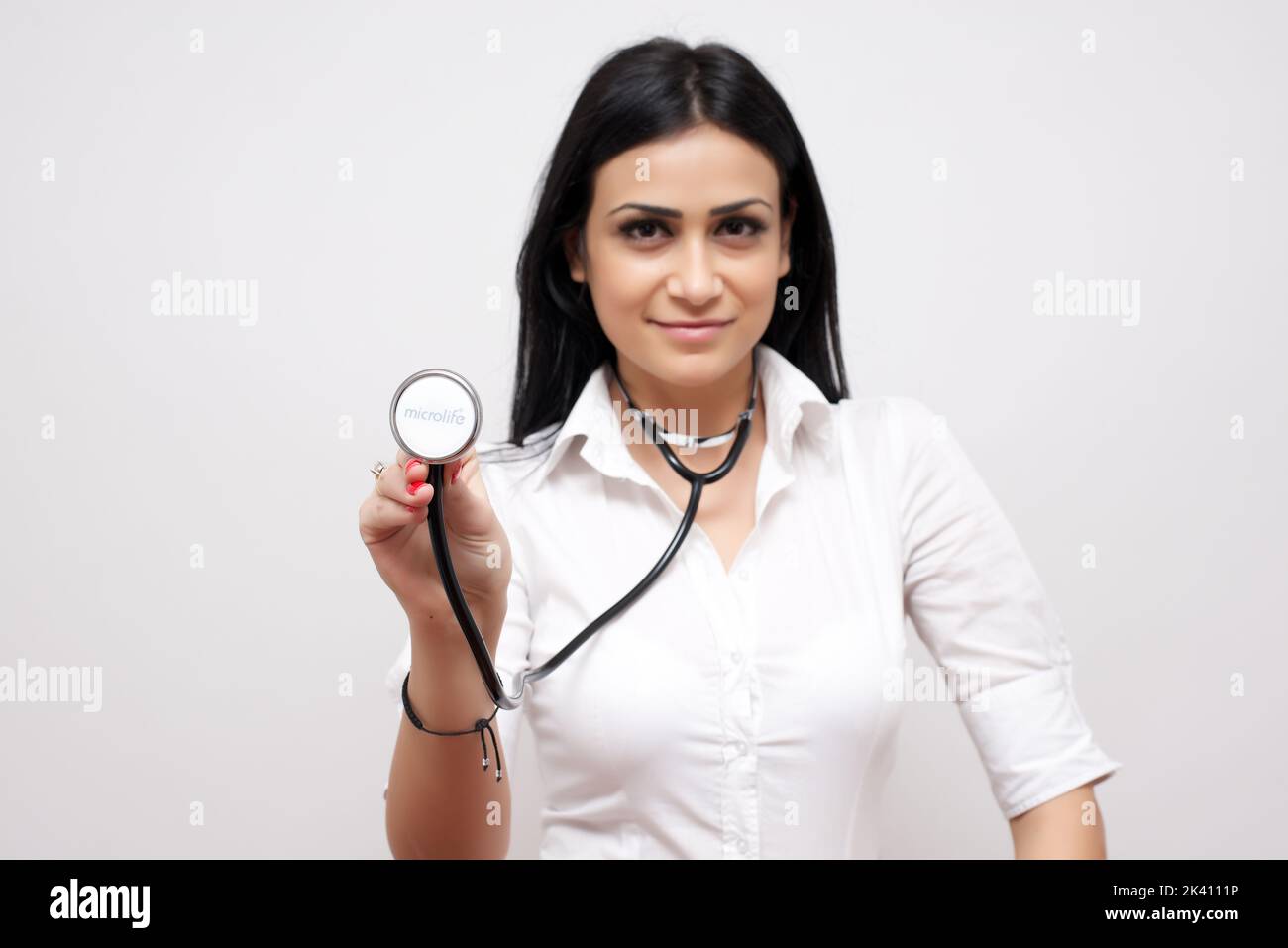 Portrait of beautiful female doctor doing different things - Stock ...