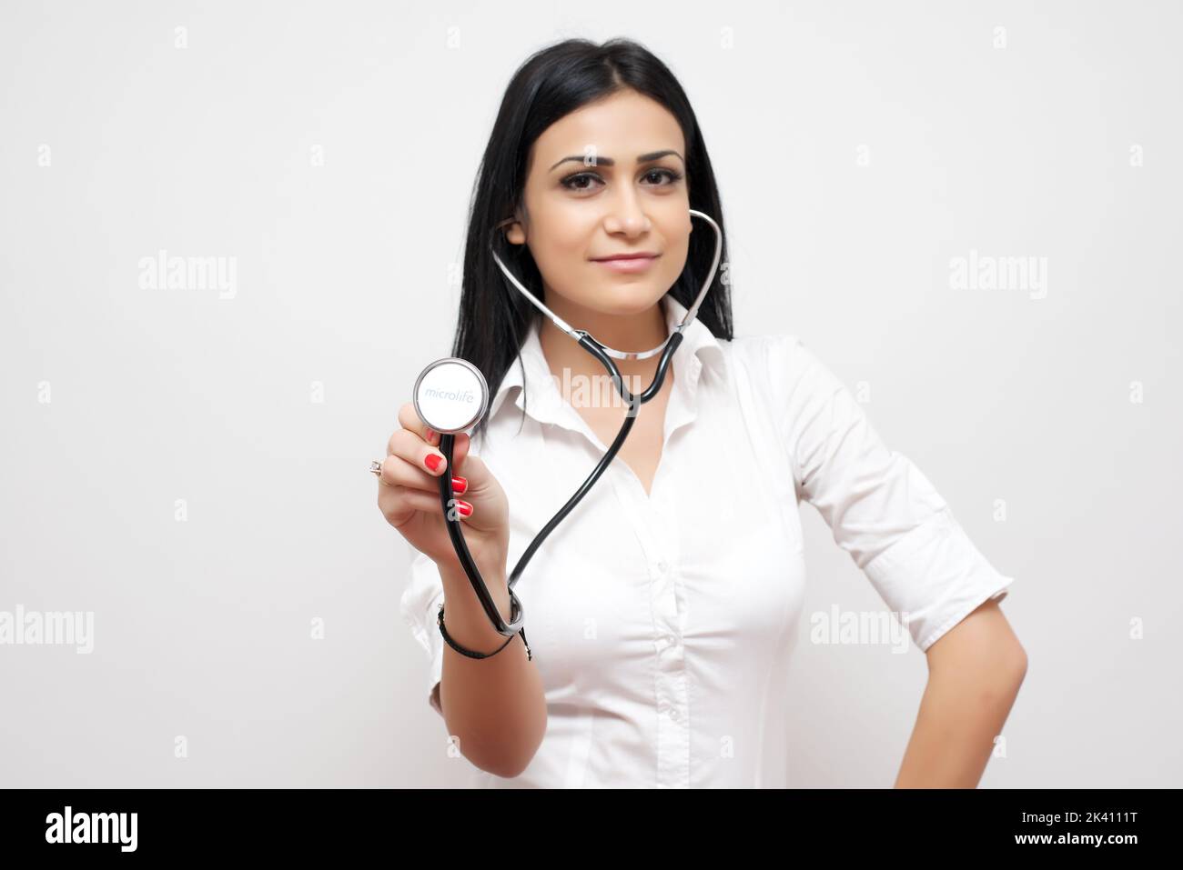 Portrait of beautiful female doctor doing different things - Stock ...