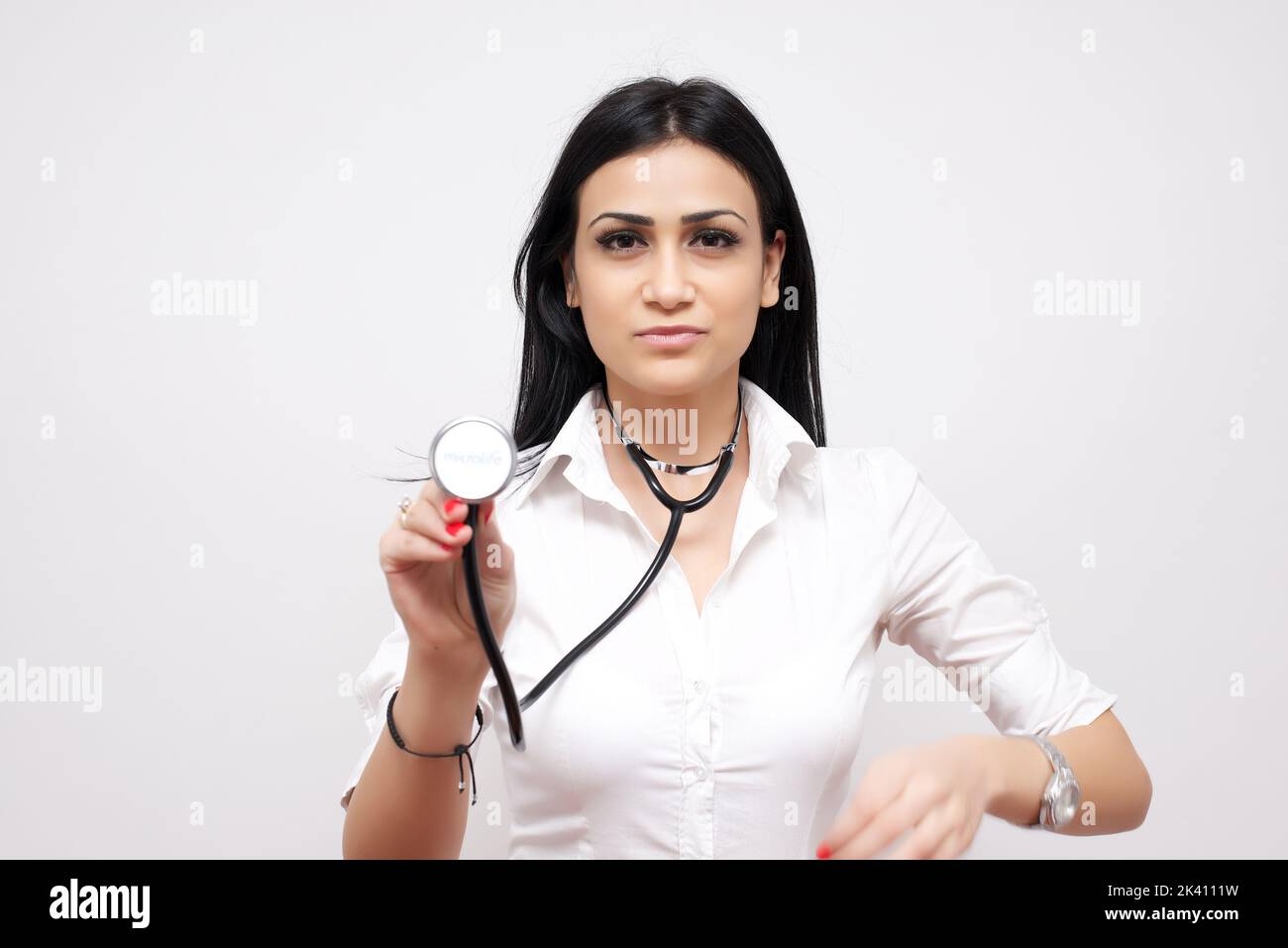 Portrait of beautiful female doctor doing different things - Stock ...