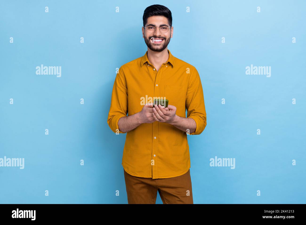 Photo of smart clever young positive man dressed yellow shirt in ...