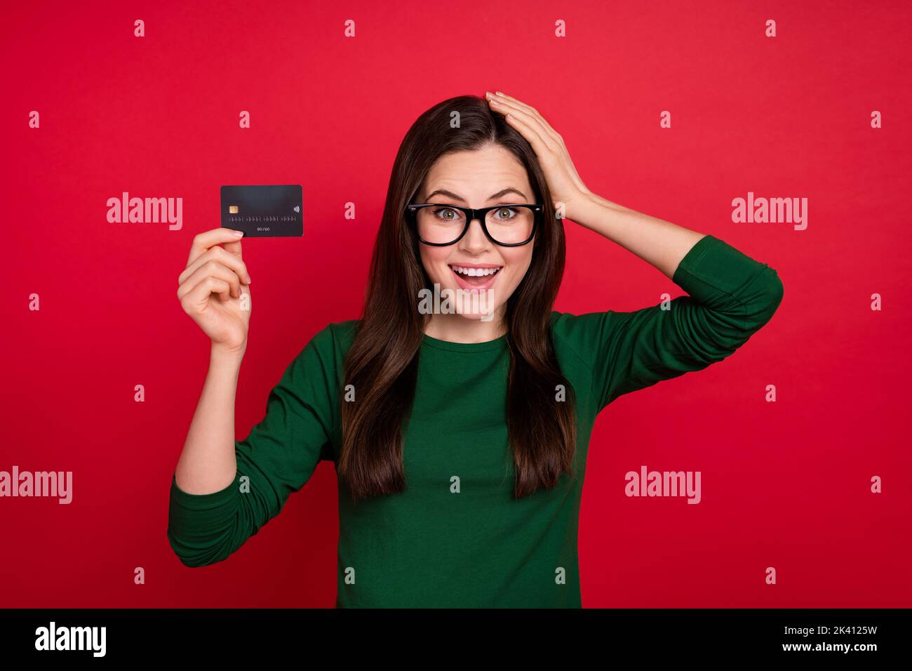 Photo of impressed brunette millennial lady hand head wear eyewear ...