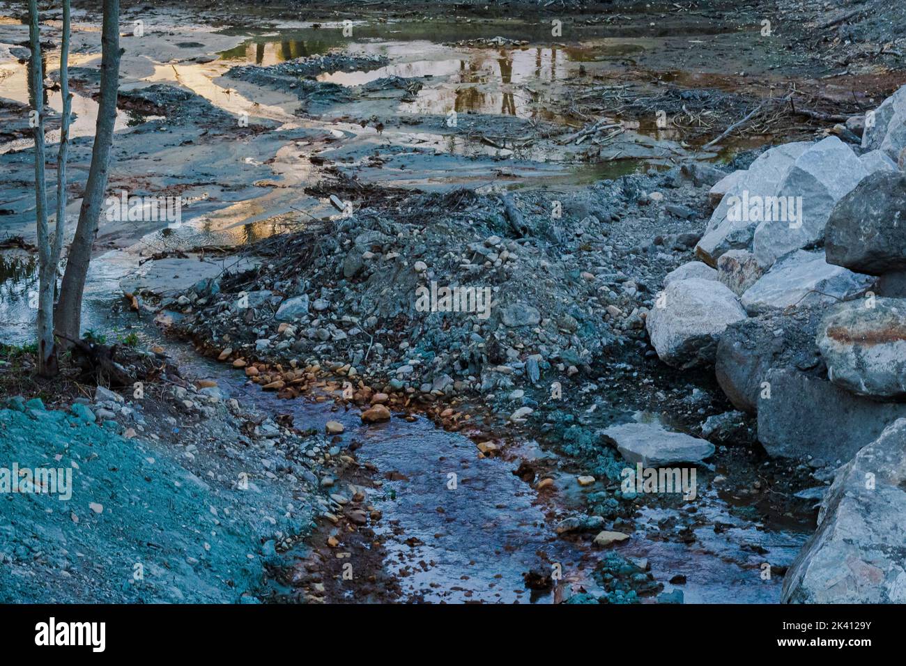 Close up view of a dry river with rest of mineral on the surface ...