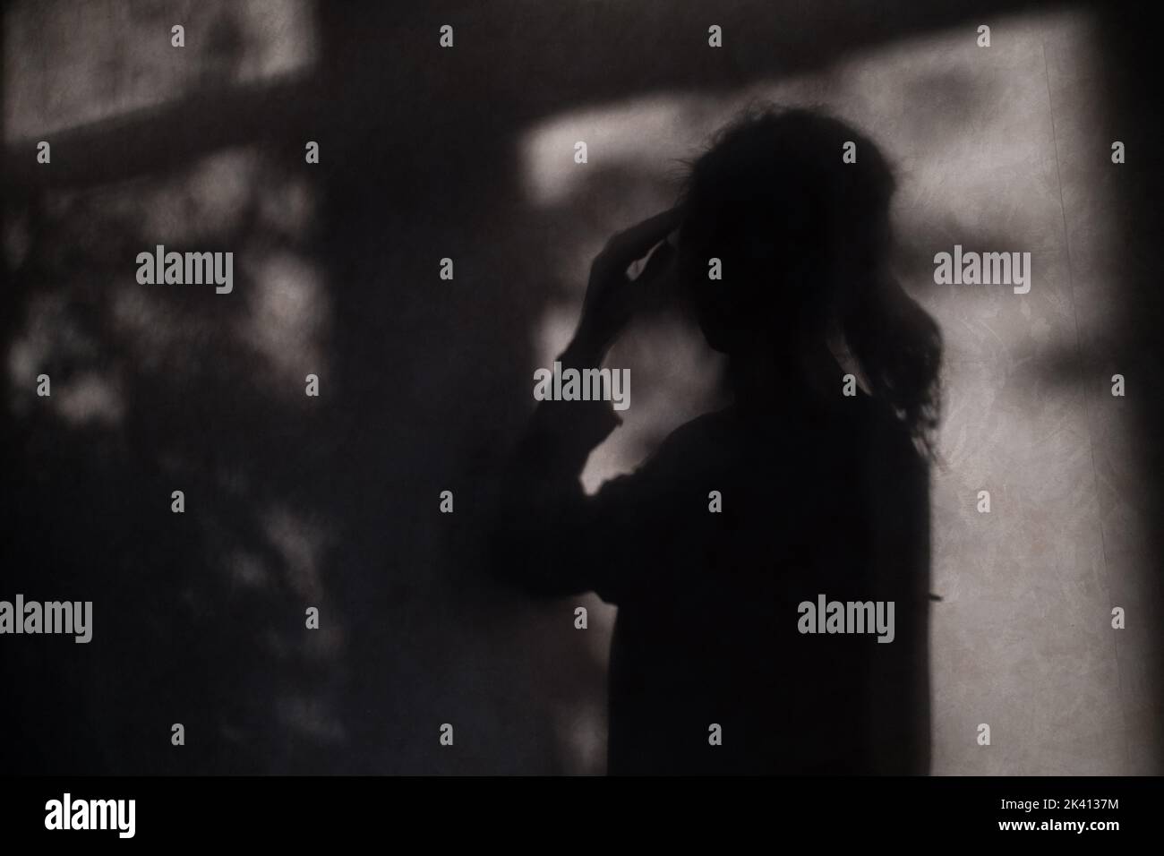 Silhouette of lonely woman at home. Unknown female person shadow on ...