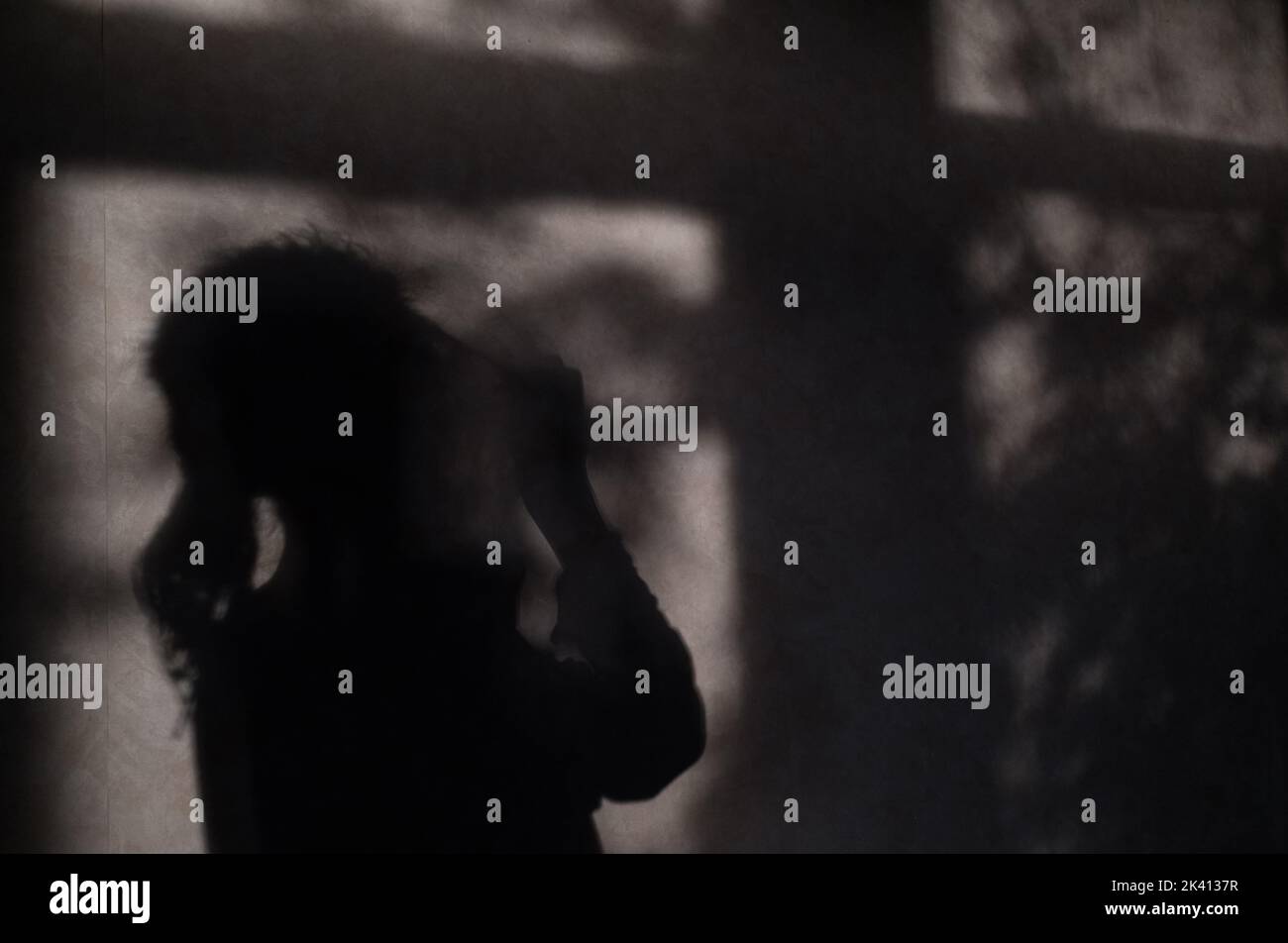 Silhouette of lonely woman at home. Unknown female person shadow on ...