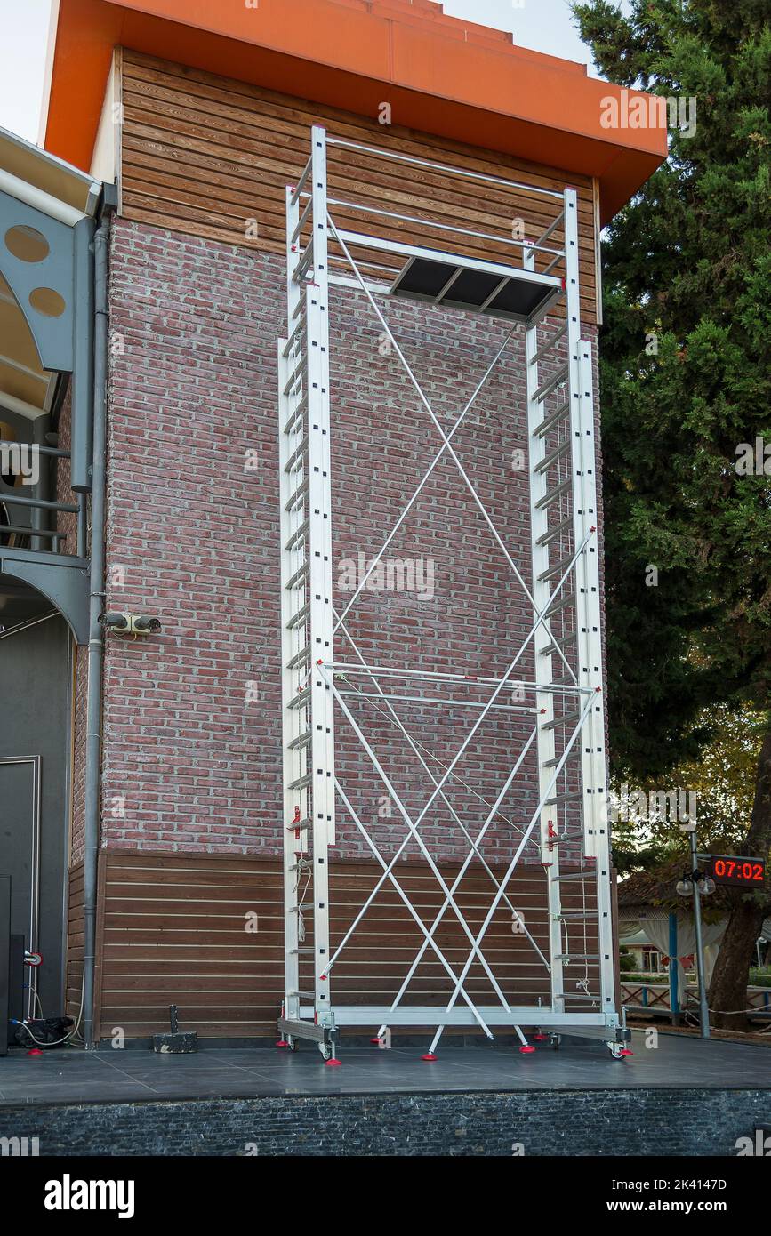 Height scaffolding by the building wall Stock Photo - Alamy