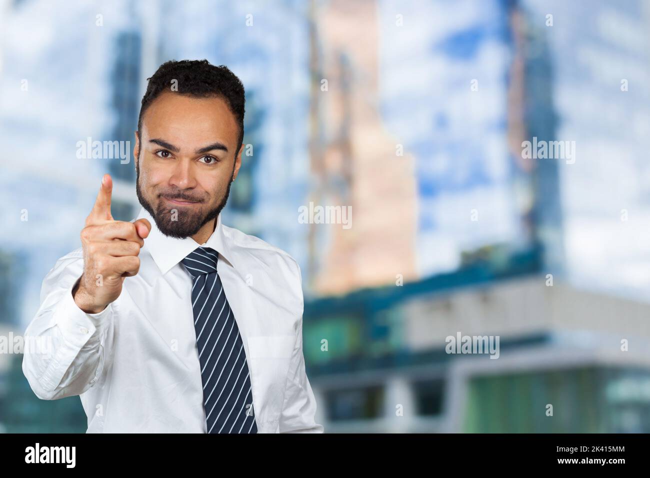 Photo of emotional angry young african man standing isolated Stock ...