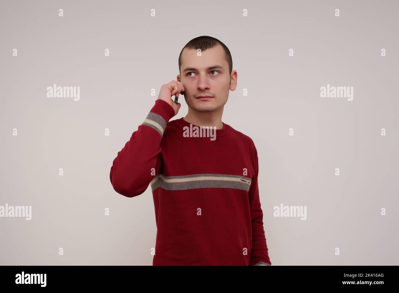 Young man calling stock photo Stock Photo - Alamy