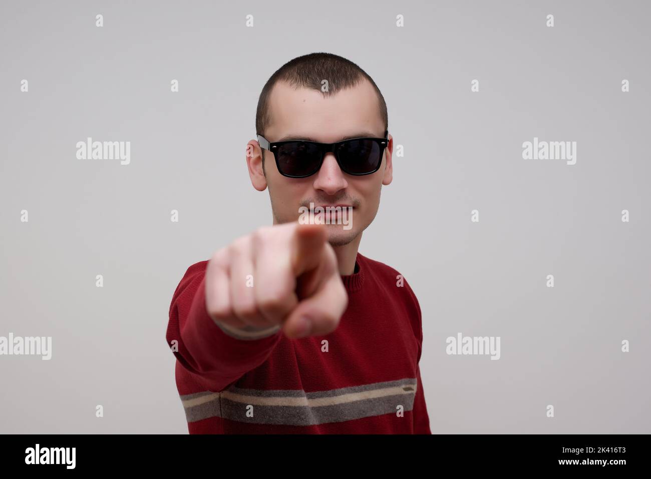 Young man pointing finger towards you and to the camera stock photo ...