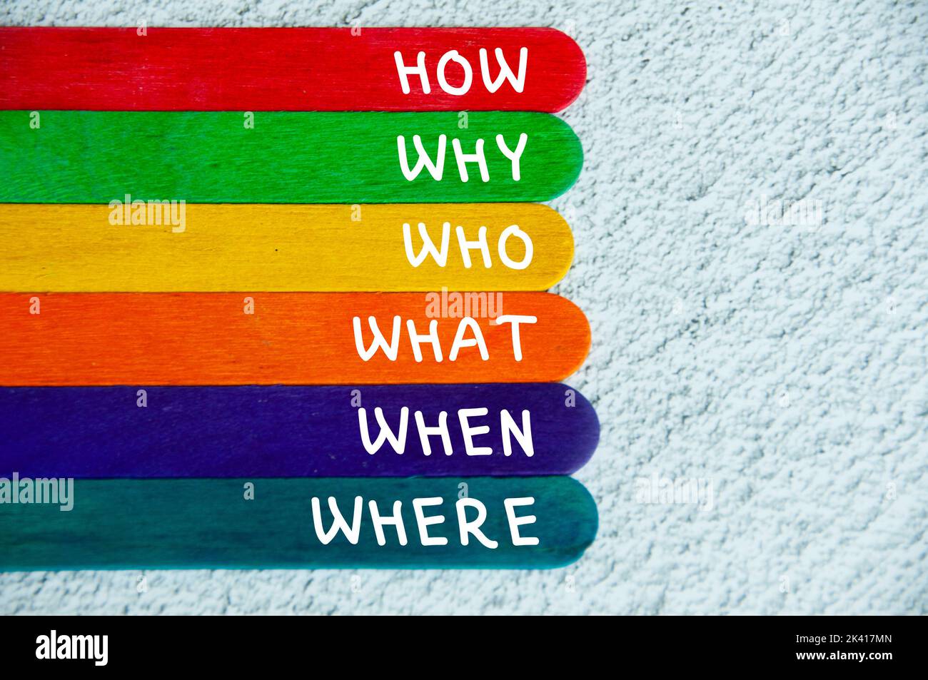 Text on wooden color sticks - How, Why, What, When, Where, Who. Fact ...
