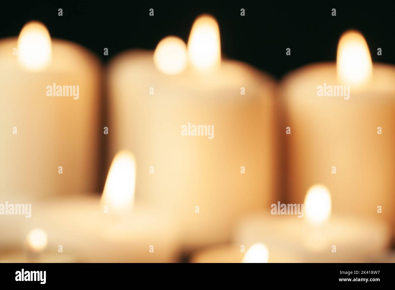 Burring candles on decorative glass. Dark background. Blur Stock Photo ...