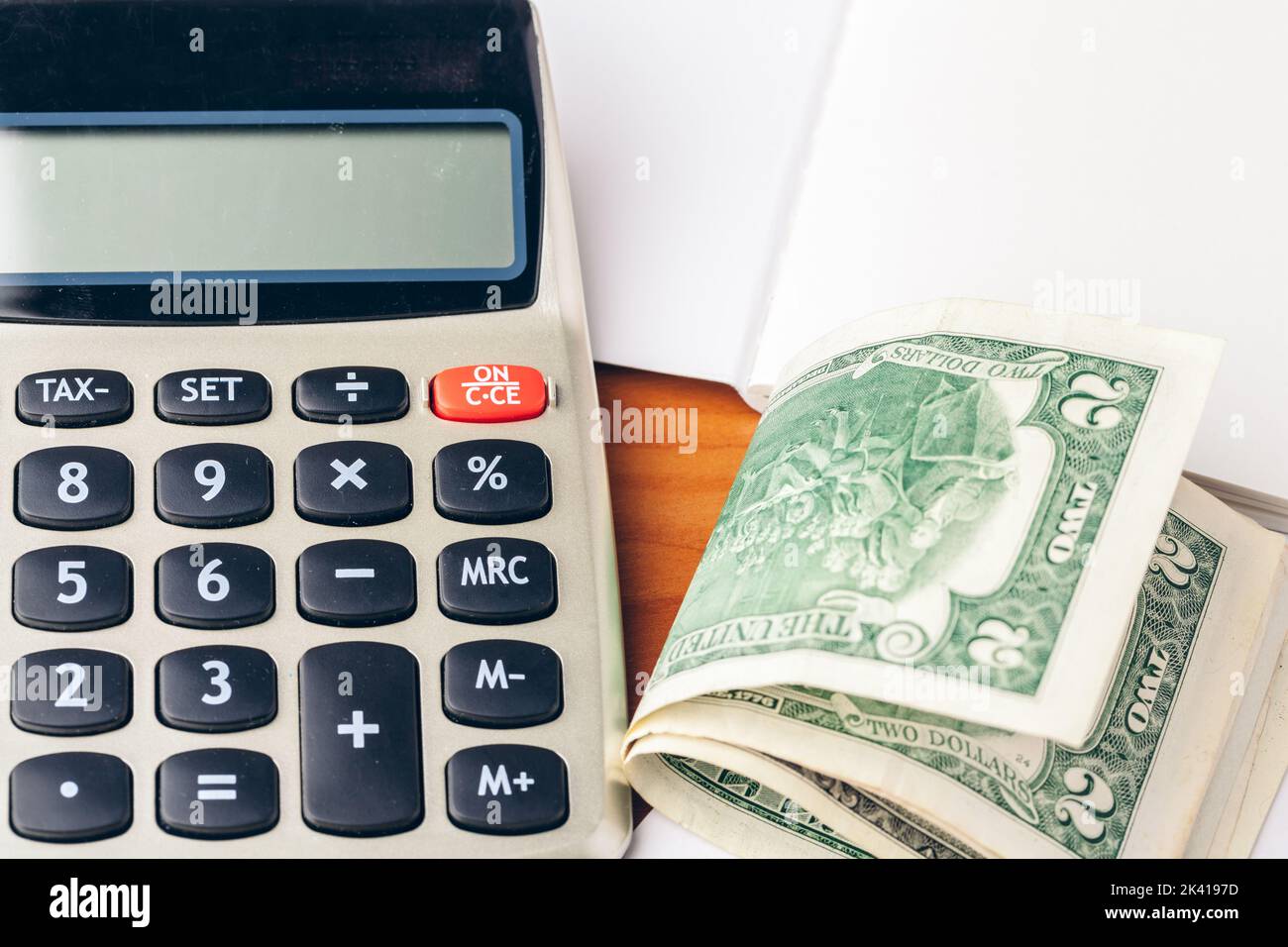 Close up of a calculator and coins on a business background Stock Photo ...