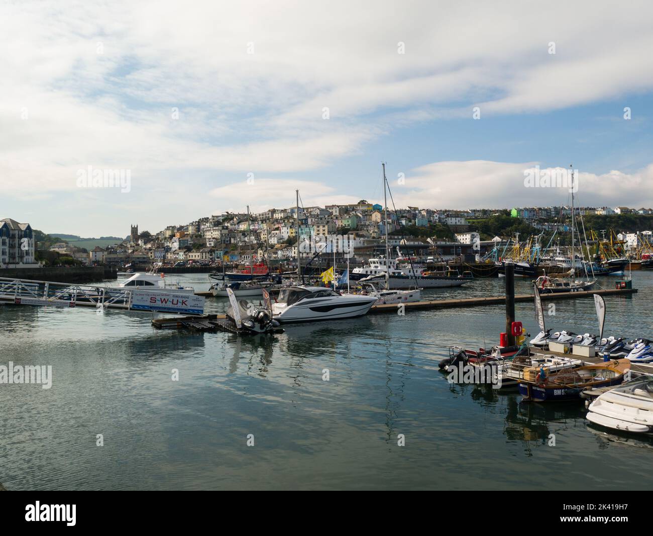 View from King's Quay across Brixham Marina and harbour towards pastel ...