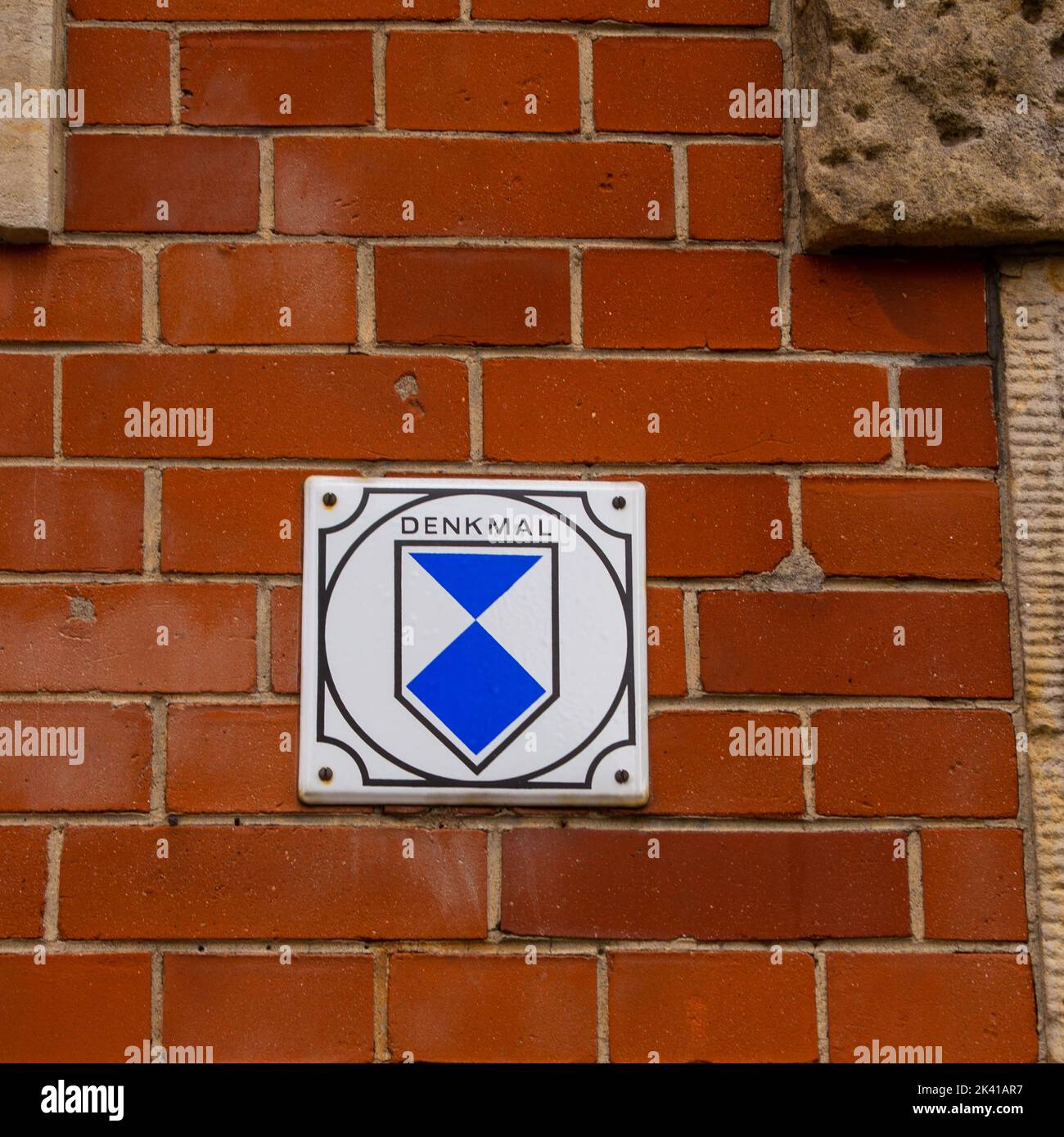 Sign in german on a building's wall indicating the building is ...