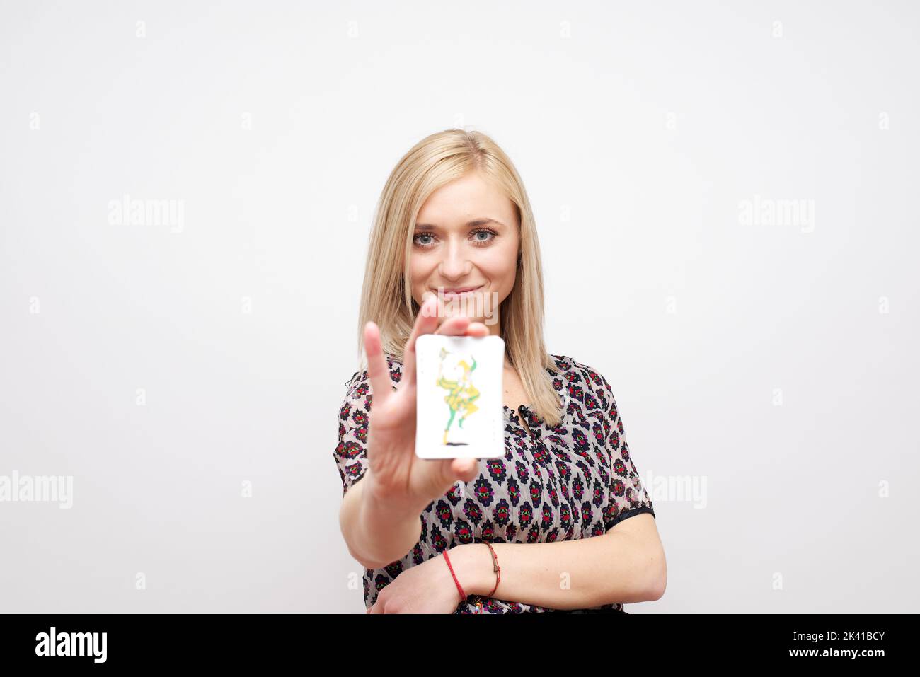 Woman multiple expression image on white background, holding different ...