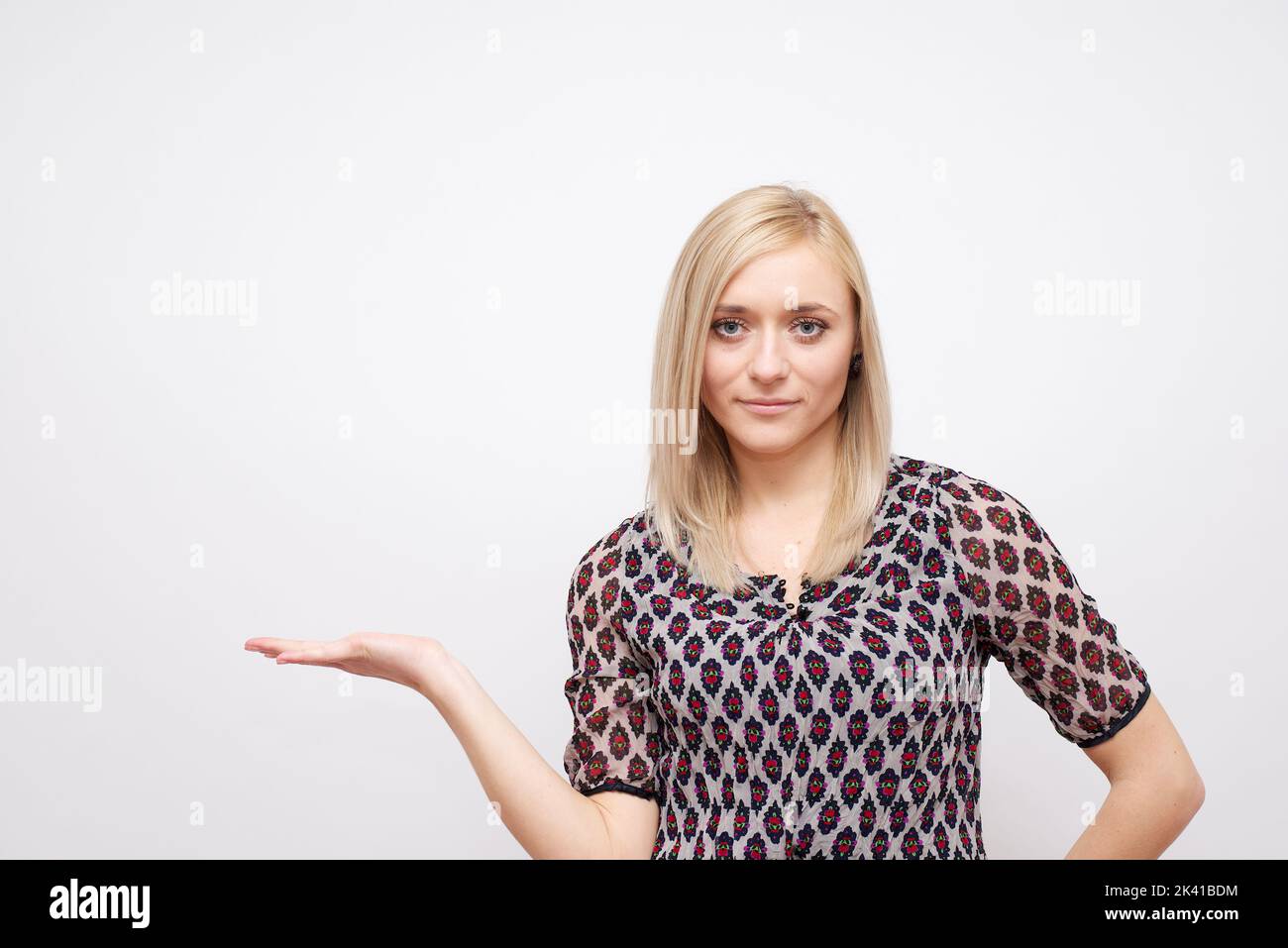 Young shows something isolated on white background stock photo Stock ...