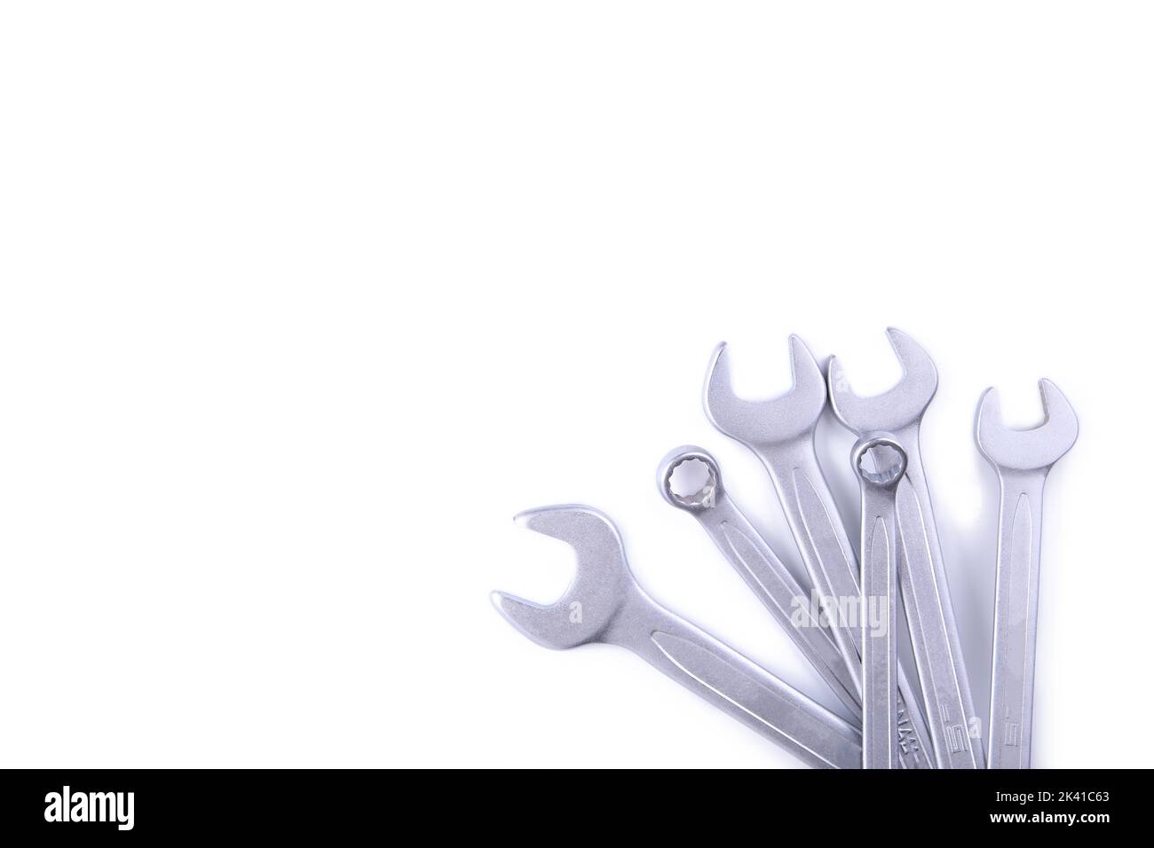 Combination wrenches for repair on white table Stock Photo - Alamy