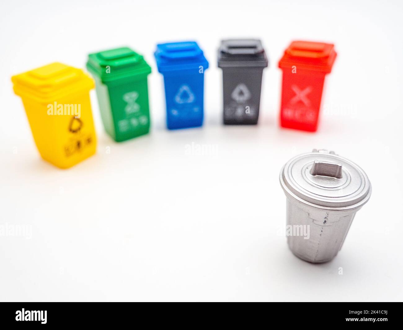 various colored recycle bins for different type of trash versus ...