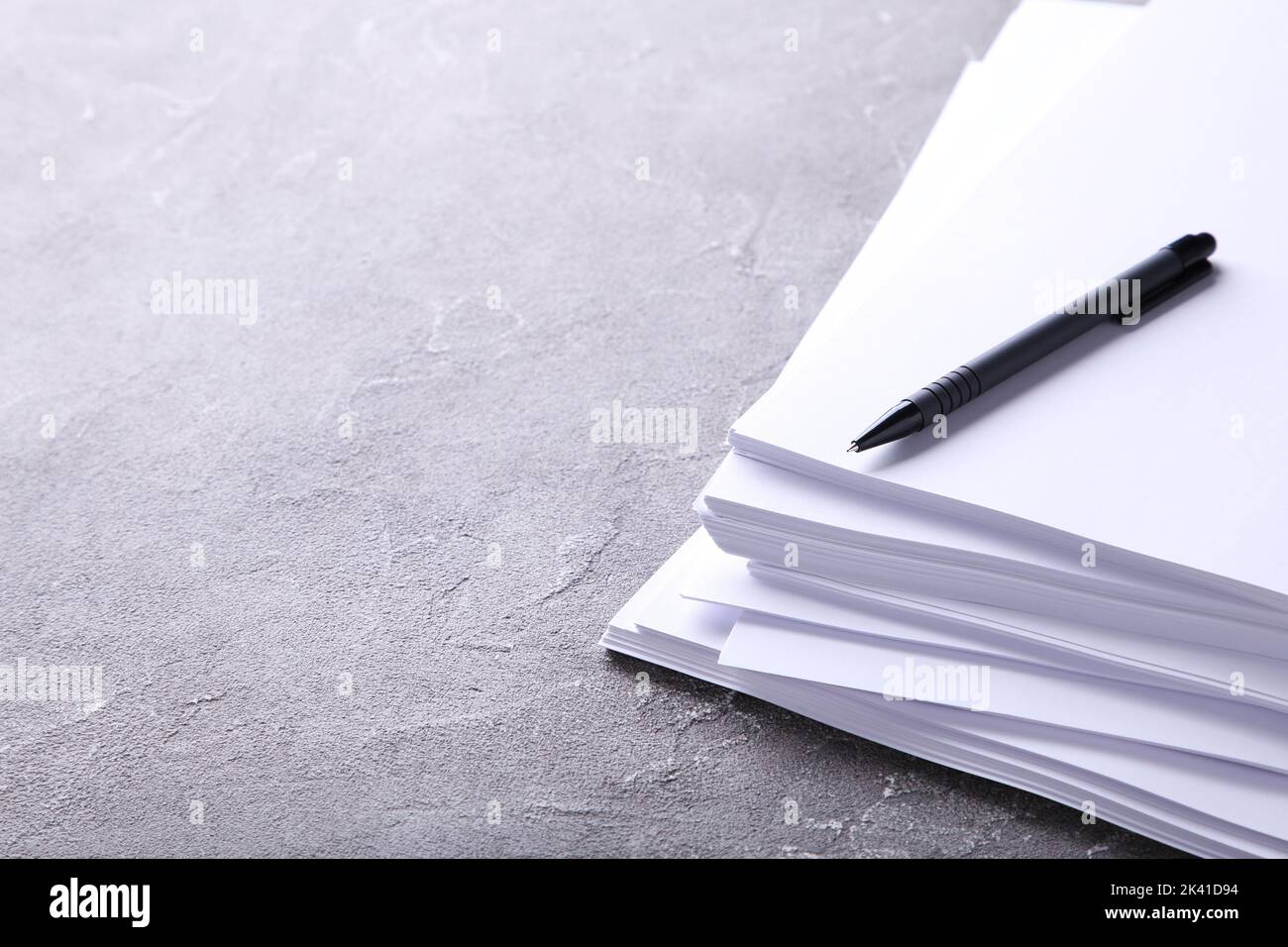 Stack white paper with pen on grey background with Clipping Path Stock ...