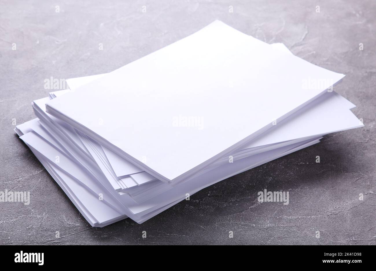 Stack white paper on grey background with Clipping Path Stock Photo - Alamy