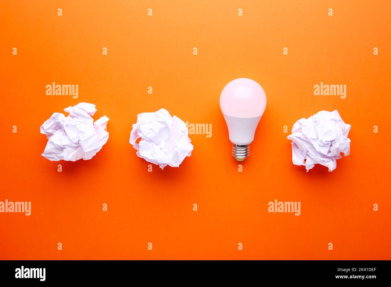 Crumbled paper on a orange background, flat lay Stock Photo - Alamy