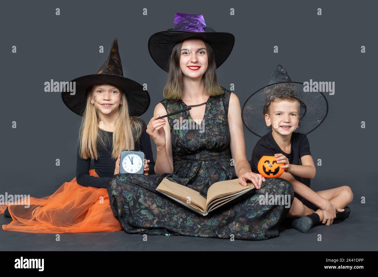 Family Halloween. A happy family in creepy costumes of witches and ...