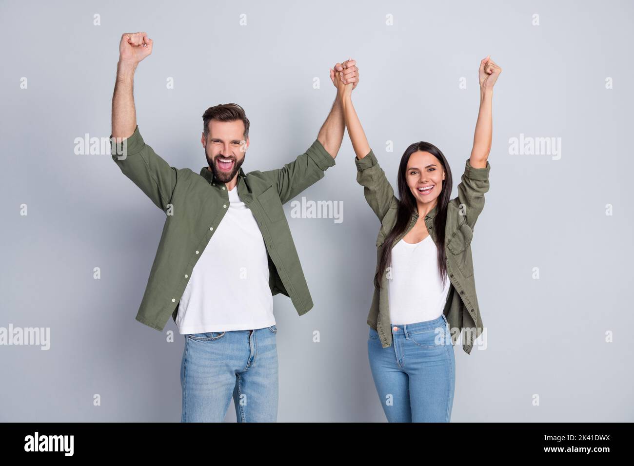 Portrait of attractive cheerful couple best successful team rejoicing ...