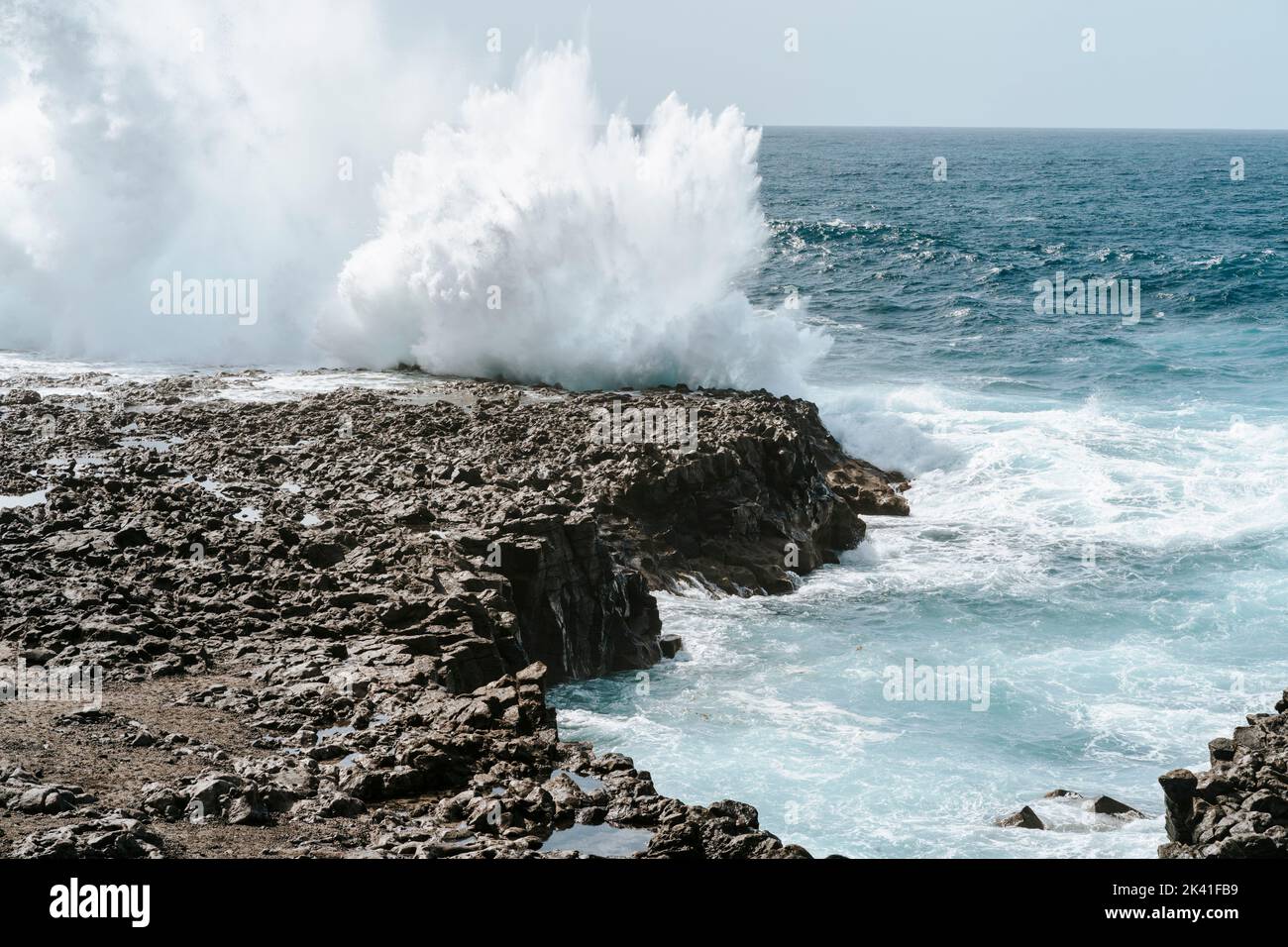 Water splash on black volcanic rocks of Tenesar, Lanzarote, Canary ...