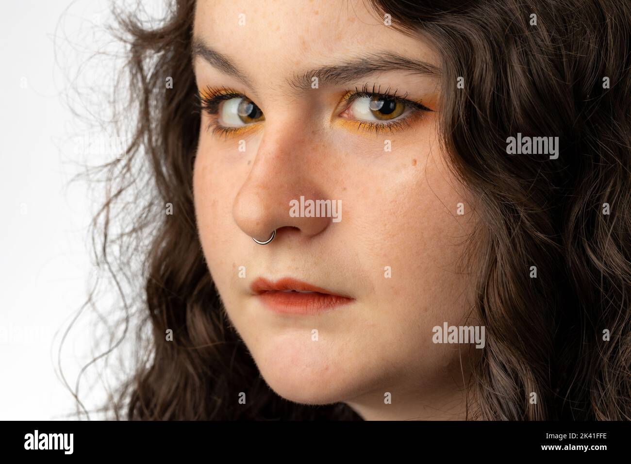 Beautiful lady with quizical look into camera Stock Photo - Alamy