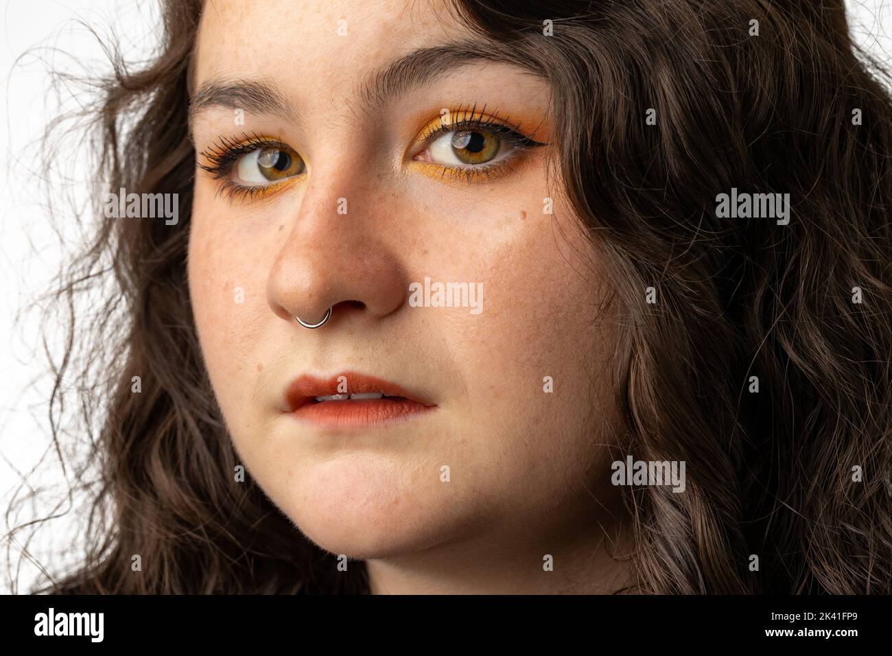 Young lady with wondering look, looking at camera Stock Photo - Alamy