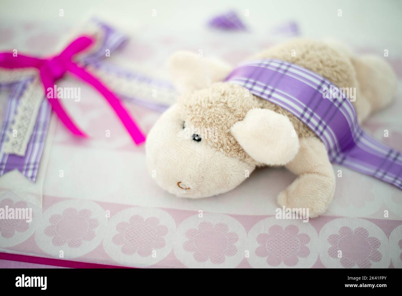 A small sheep sitting on a box Stock Photo - Alamy