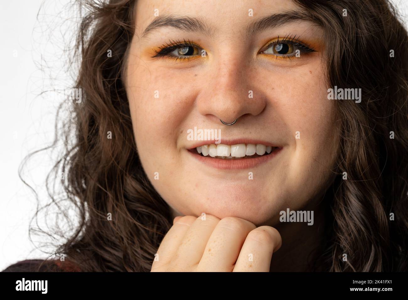 Beautiful young woman smiling into camera Stock Photo - Alamy