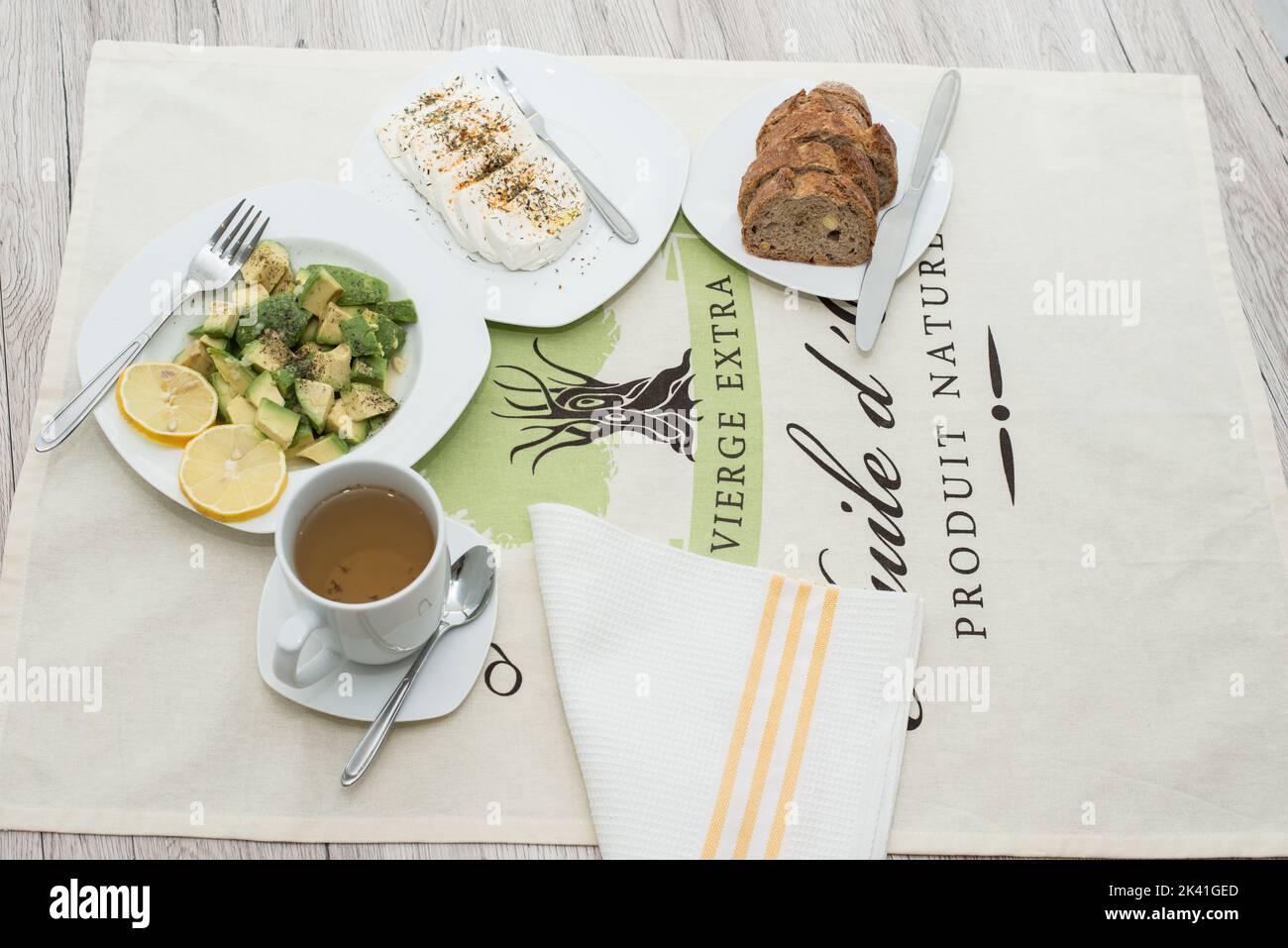 Healthy breakfast with tea, cheese, bread and avocado Stock Photo - Alamy