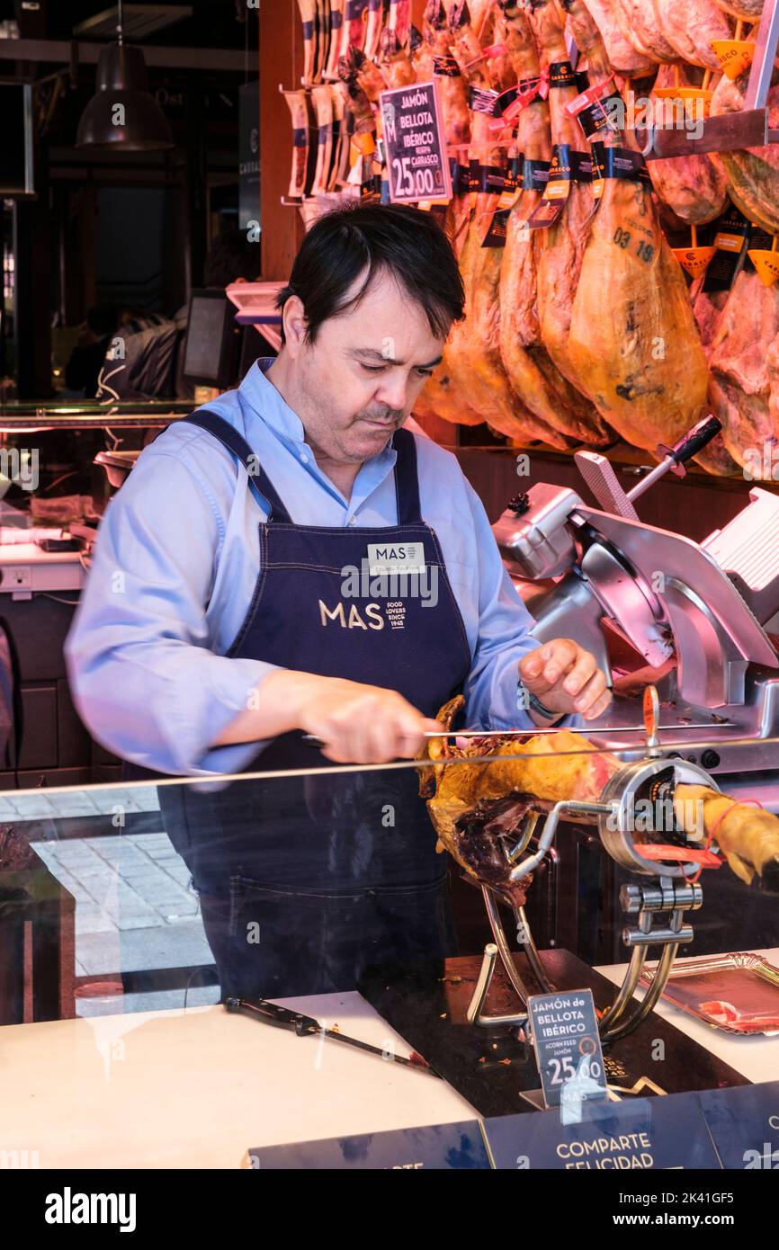 Spain, Madrid. Market of San Miguel. Slicing Ham for a Customer Stock ...