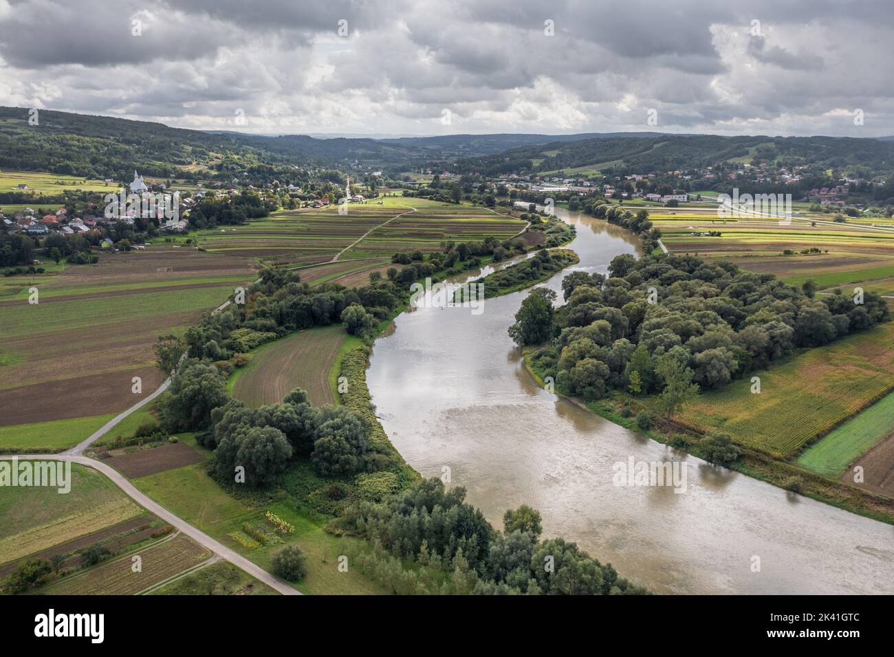 San river near Dynów, view on Dynowskie Przemyskie Hills, Poland aerial view, cloudy day, late ...