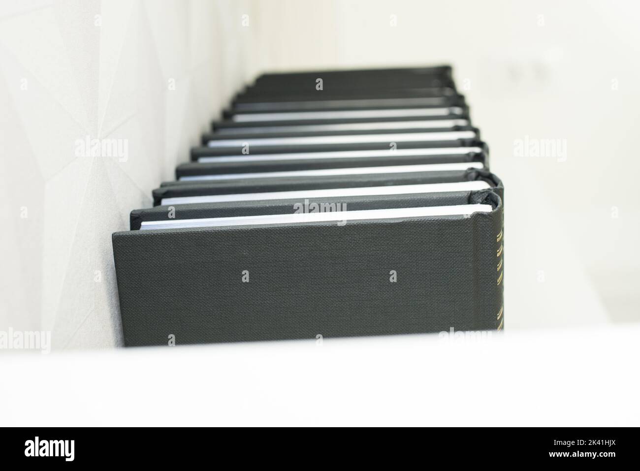 Row of books on bookshelf Stock Photo - Alamy