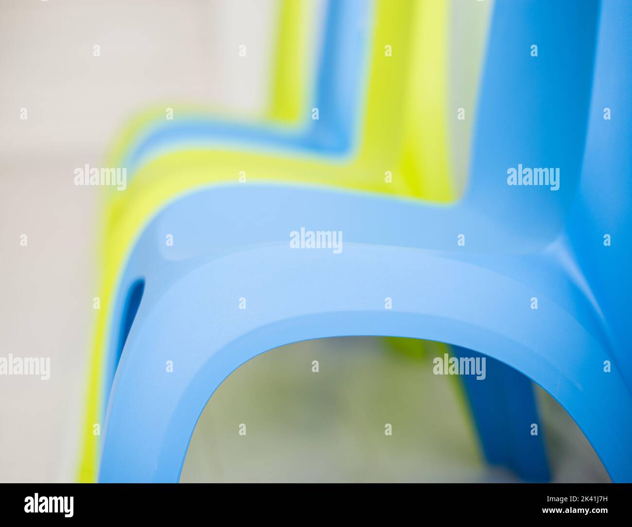 Blue plastic chair close up Stock Photo - Alamy