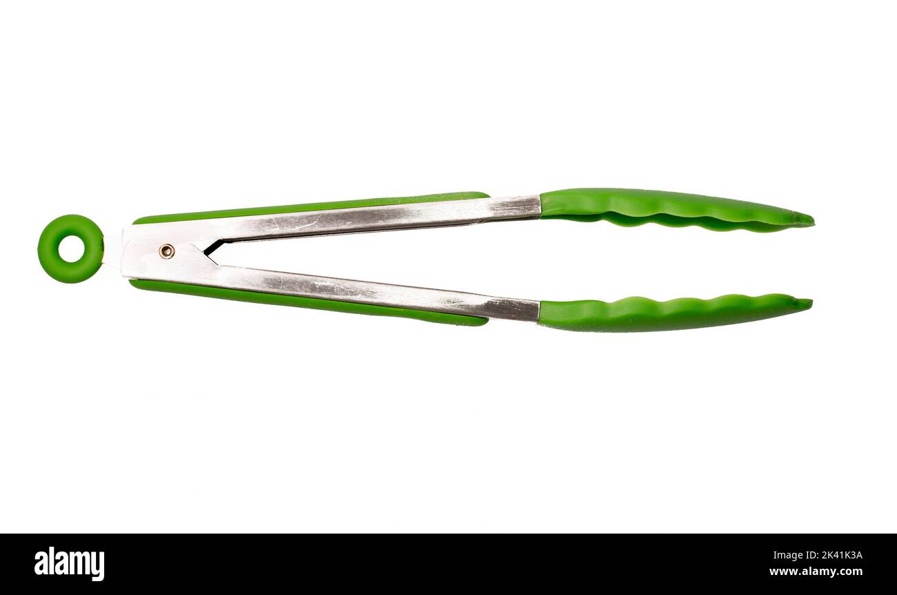 Green cooking tongs on a white background Stock Photo - Alamy