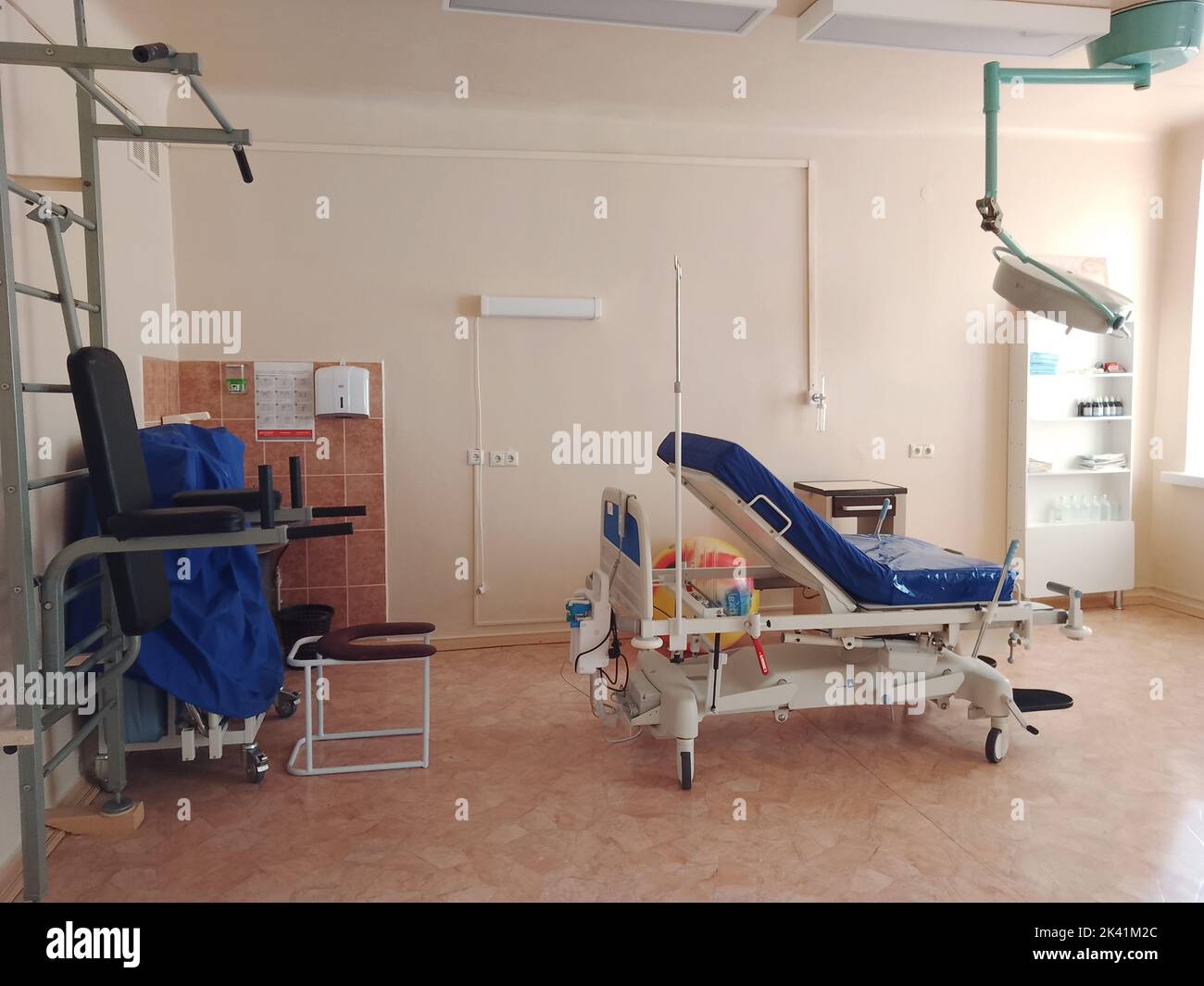 Maternity room with a gynecological gurney for childbirth, wall bars ... Maternity room with a gynecological gurney for childbirth, wall bars ...
