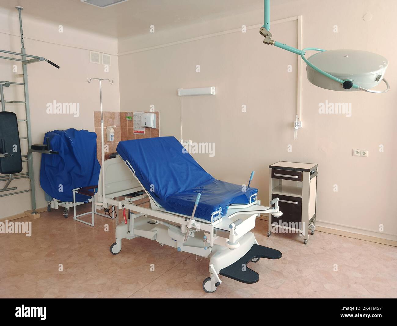 Maternity room with a gynecological gurney for childbirth, wall bars ... Maternity room with a gynecological gurney for childbirth, wall bars ...