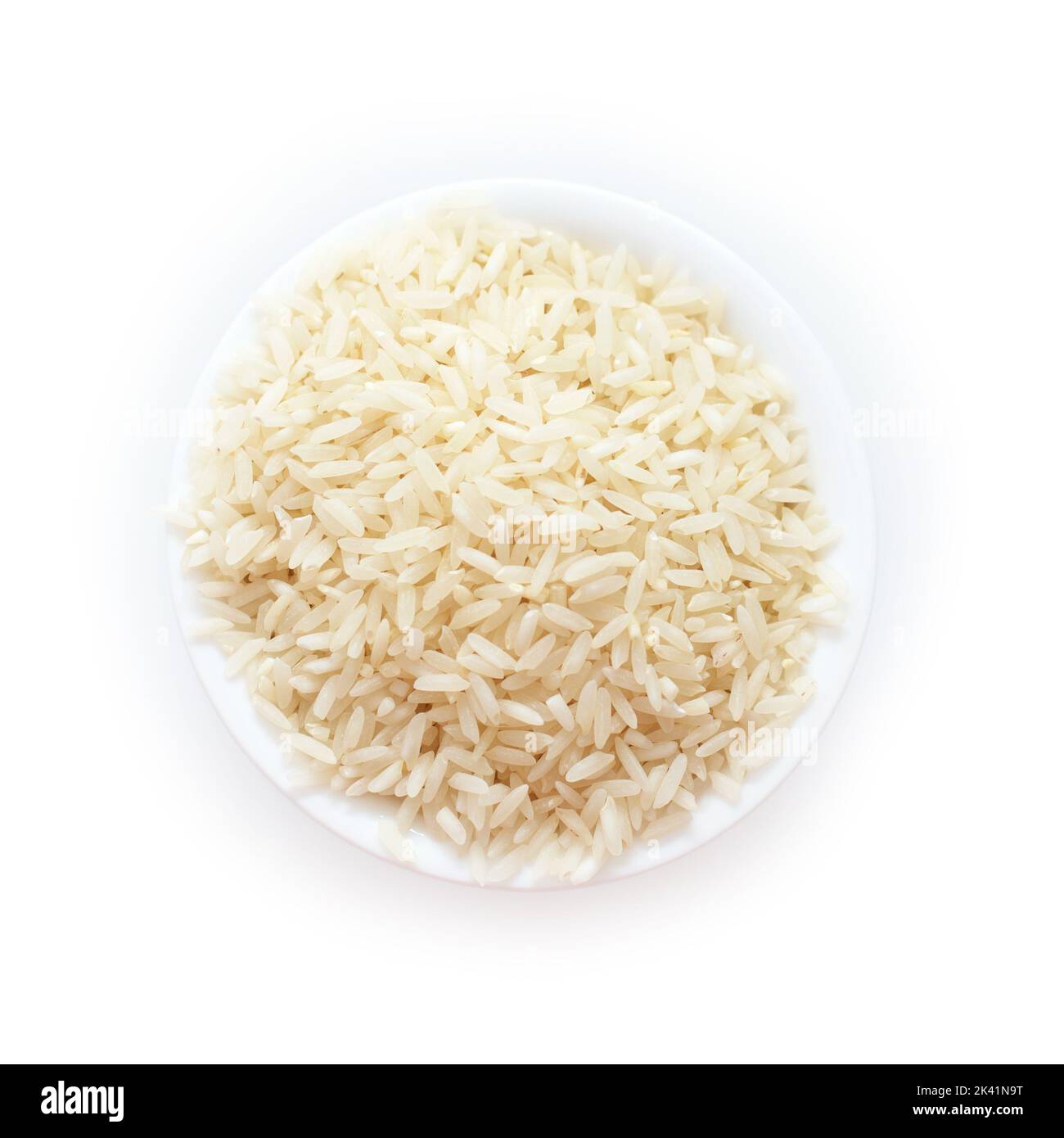 A heap of raw rice isolated on white background, top view Stock Photo ...