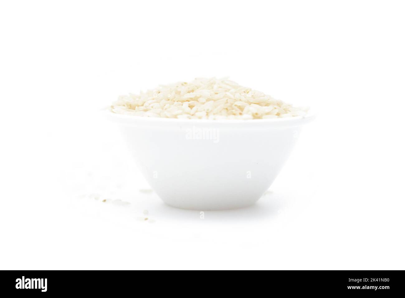 Raw rice in a bowl Stock Photo - Alamy