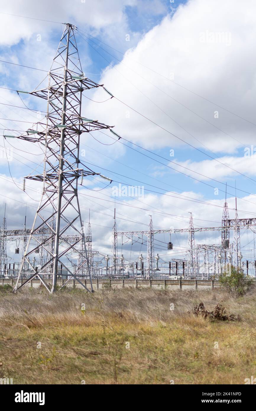 Electrical substation against blue cloudy sky Stock Photo - Alamy