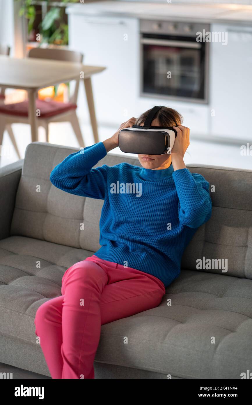 Young woman plays a game in virtual reality in 3D cyberspace simulation ...