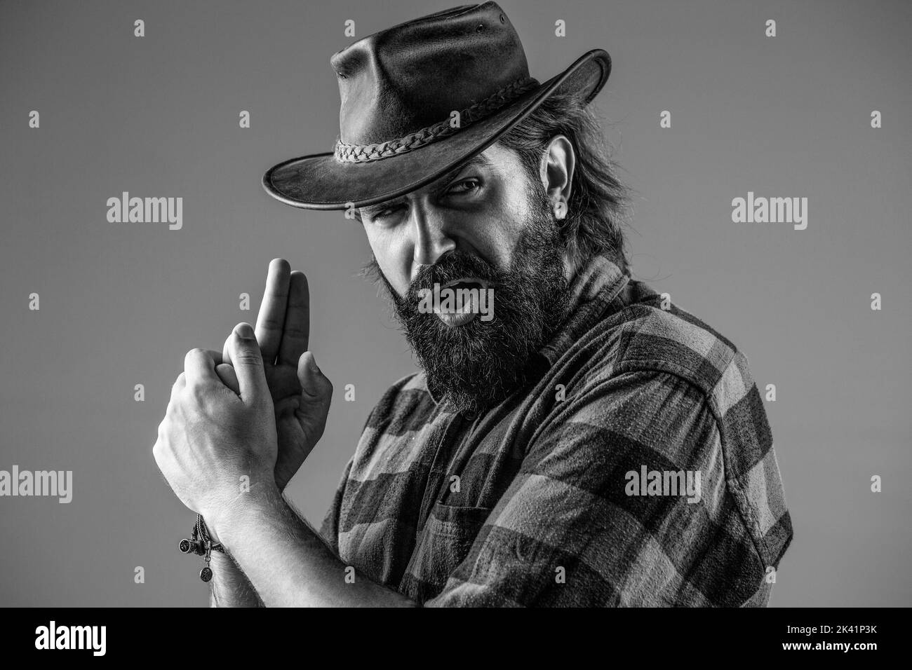 West, guns. Portrait of a cowboy. American bandit in mask, western man ...