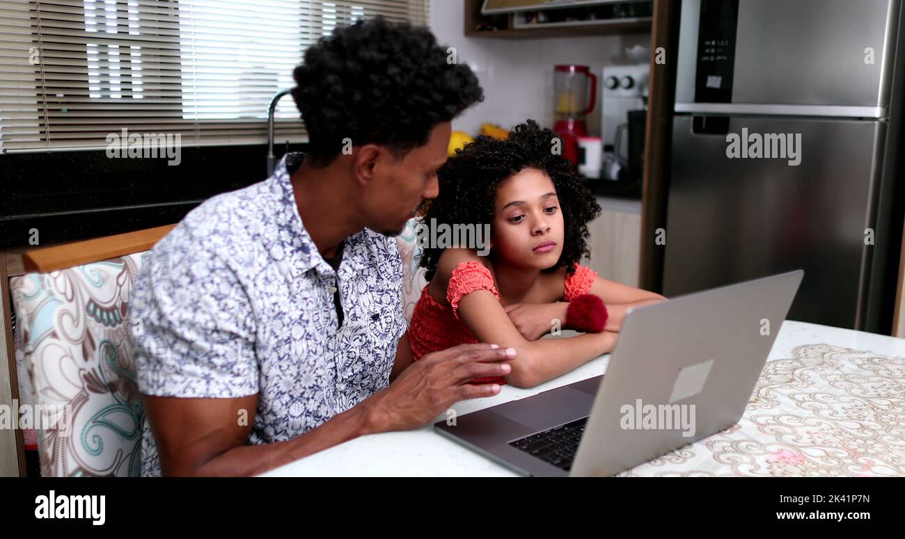 African father tutoring daughter girl in front of laptop computer2 Stock Photo - Alamy
