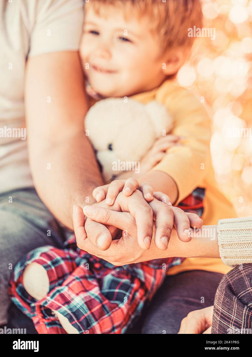 Concept of unity, support, protection, happiness. Child hand closeup ...